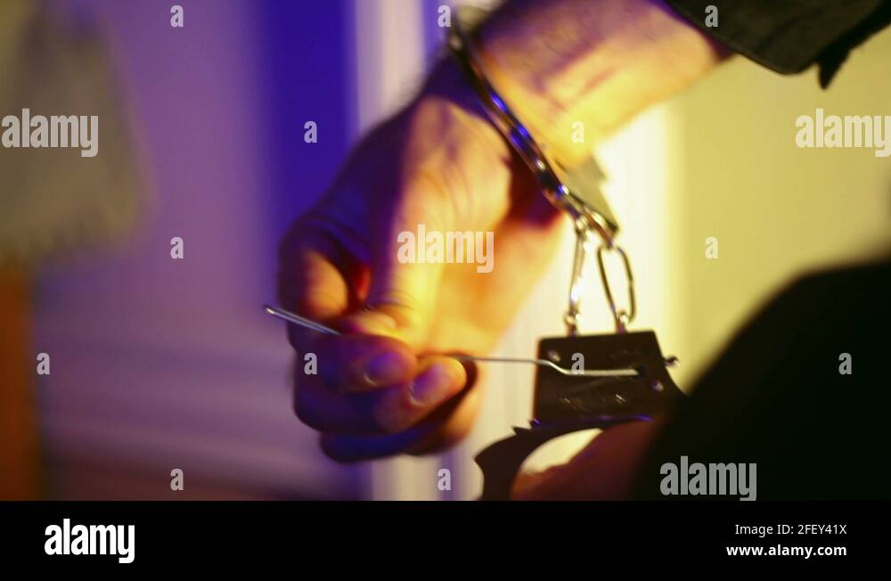 Handcuffs Stock Videos & Footage - HD and 4K Video Clips - Alamy