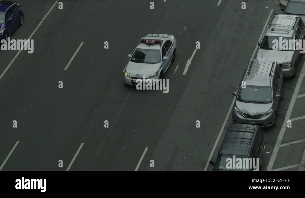 Overhead view of a police car on patrol, driving through a New York ...