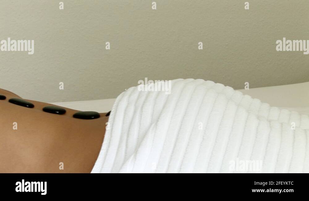 HD1080i Stone placement on the body. Stone massage. Part 1. Dolly ...