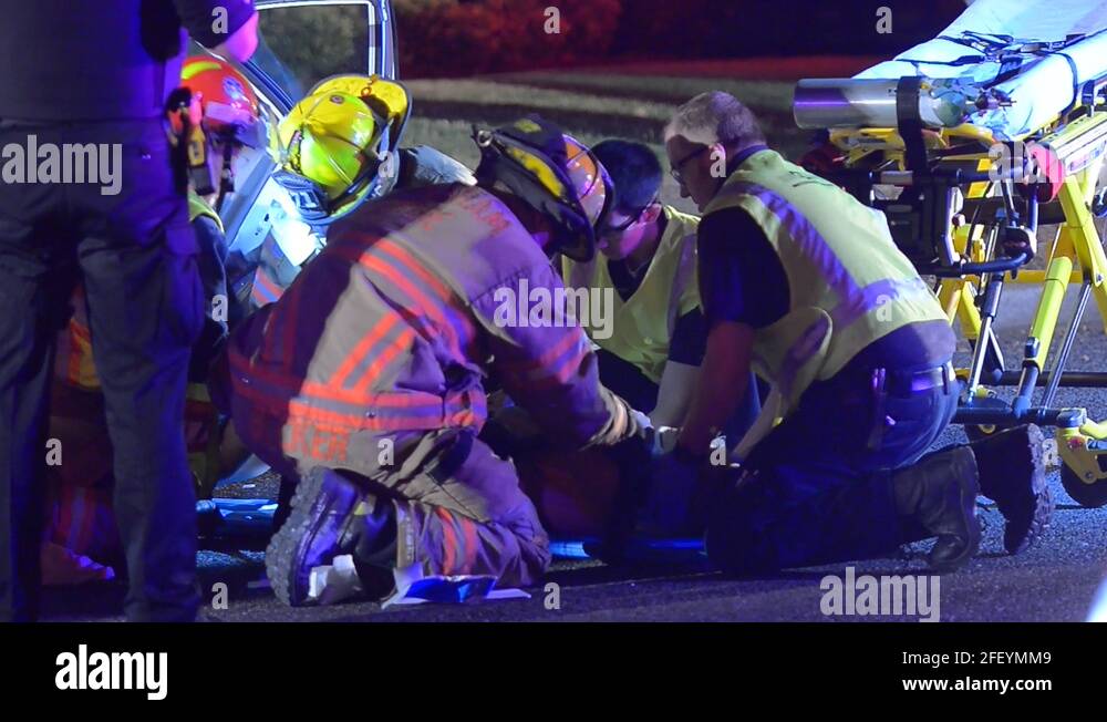 Firefighters Extricating Victim from A Car Crash 3 Stock Video Footage ...