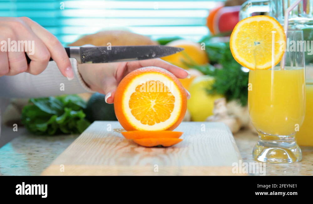 Hand cutting orange Stock Videos & Footage - HD and 4K Video Clips - Alamy