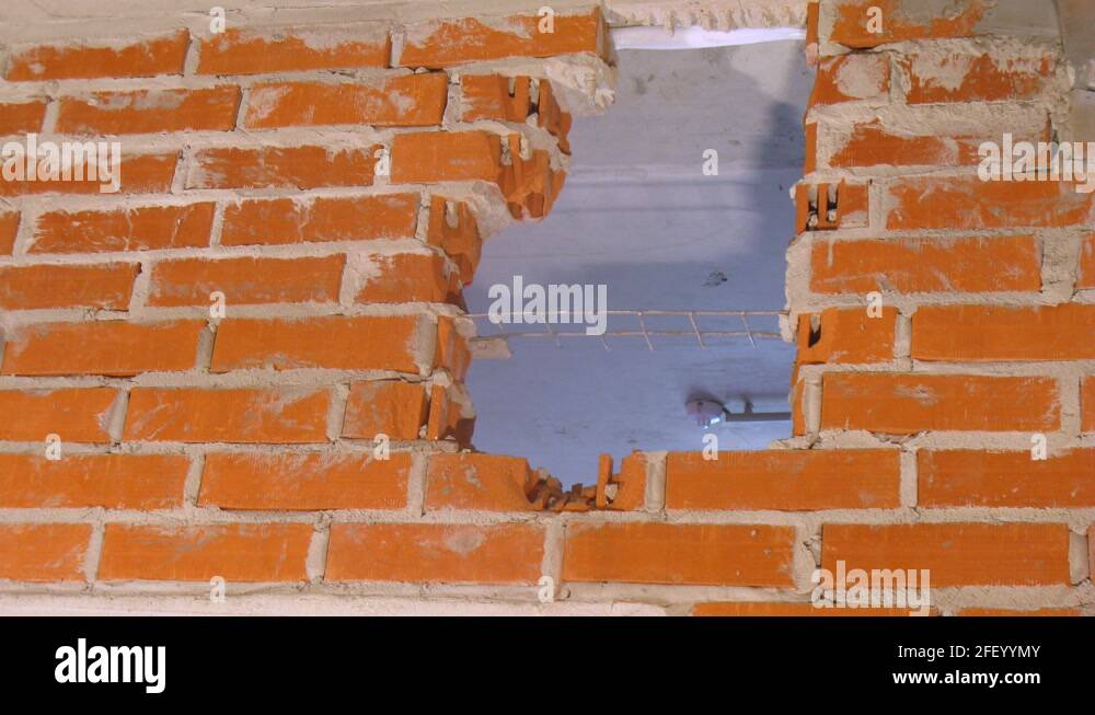 Brick wall with hole Stock Videos & Footage - HD and 4K Video Clips - Alamy