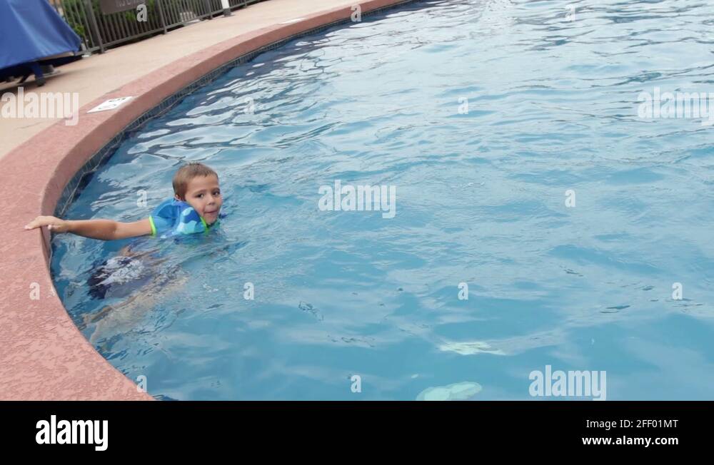 Kids playing in swimming pool Stock Videos & Footage - HD and 4K Video ...