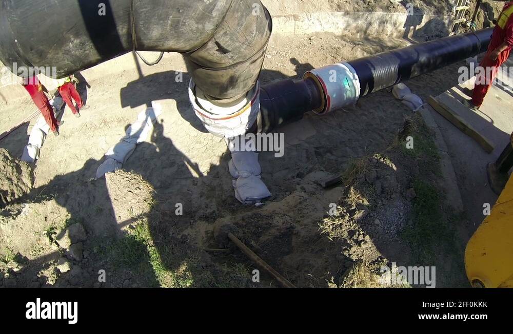 Hydraulic excavator installing pipeline Stock Videos & Footage - HD and ...