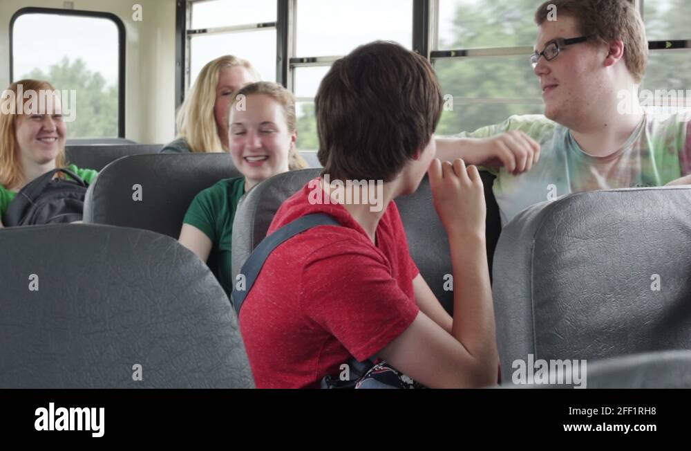 Kids riding a school bus Stock Video Footage - Alamy