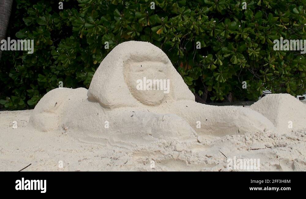 Sand Sculpture of the Sphinx on the beach. Maldives Stock Video Footage ...