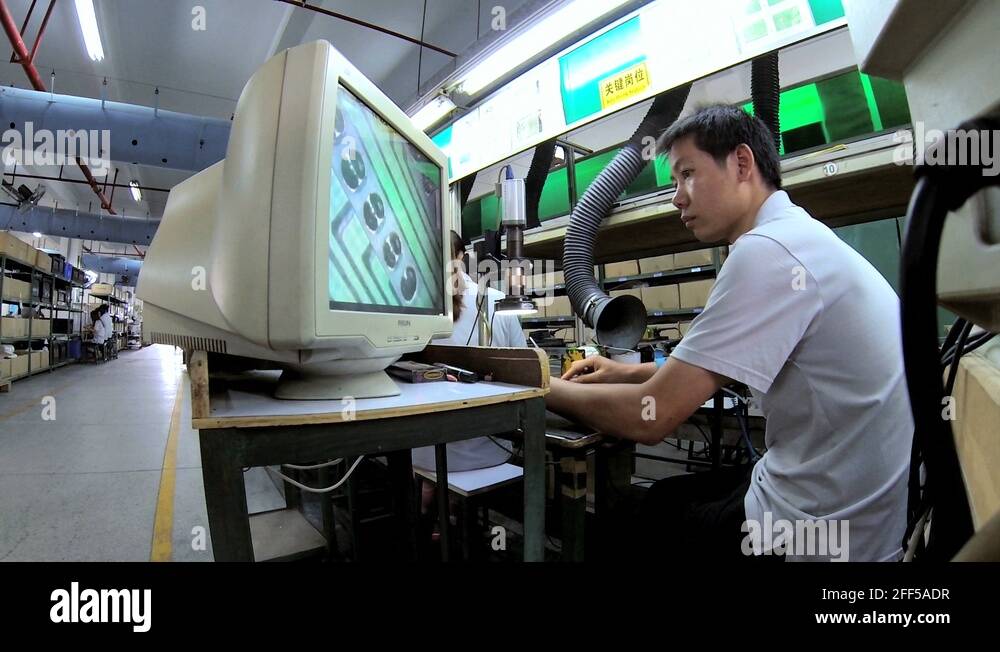 Precision quality control checks Chinese worker PCBs, China Stock Video ...
