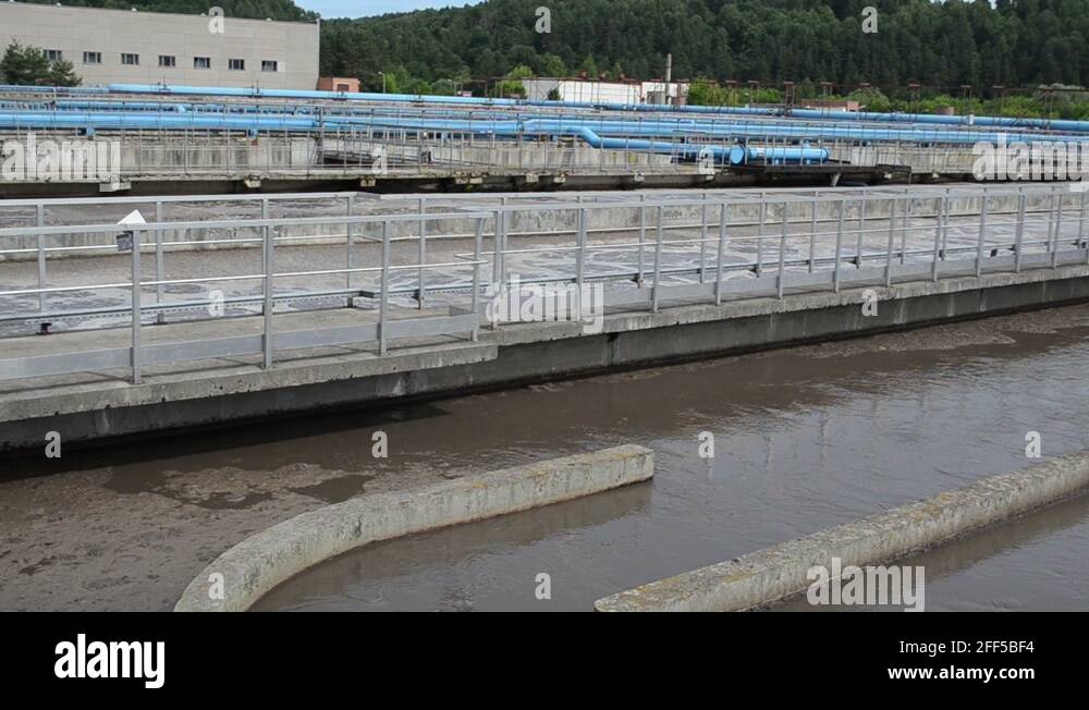 sewage water sludge settle mechanism treatment plant pools Stock Video ...