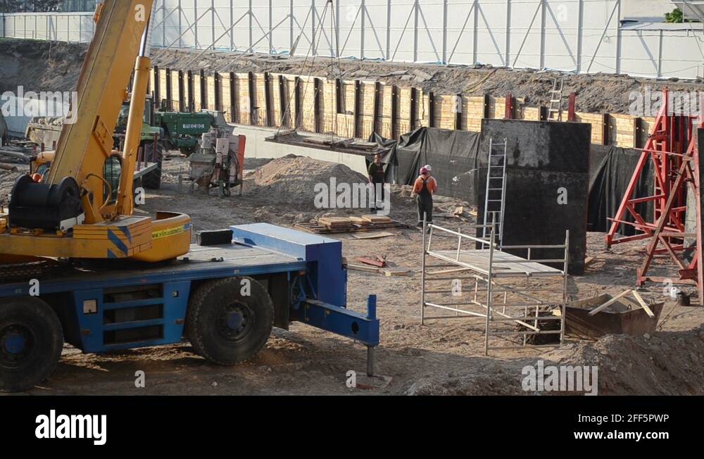 Crane lift wooden rack and workers in construction site Stock Video ...