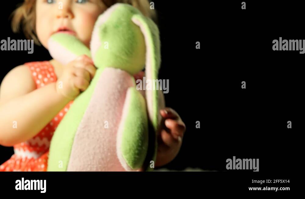 Little girl throws her stuffed animal into the air Stock Video Footage ...
