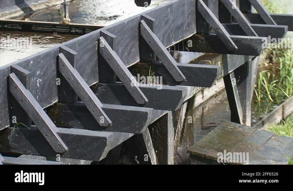 Waterway + overshot water wheel in operation - side view Stock Video ...