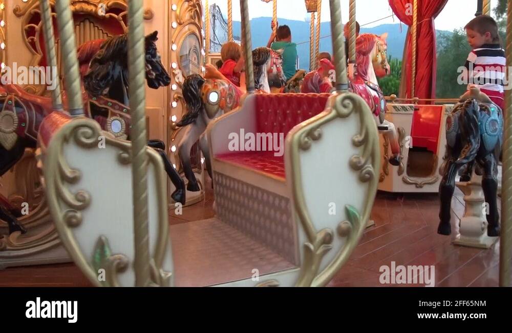 Children's carousel horse spinning around, merry-go-round, amusement ...