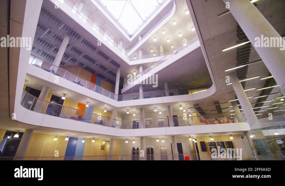 Diverse group of students in large modern university building Stock ...