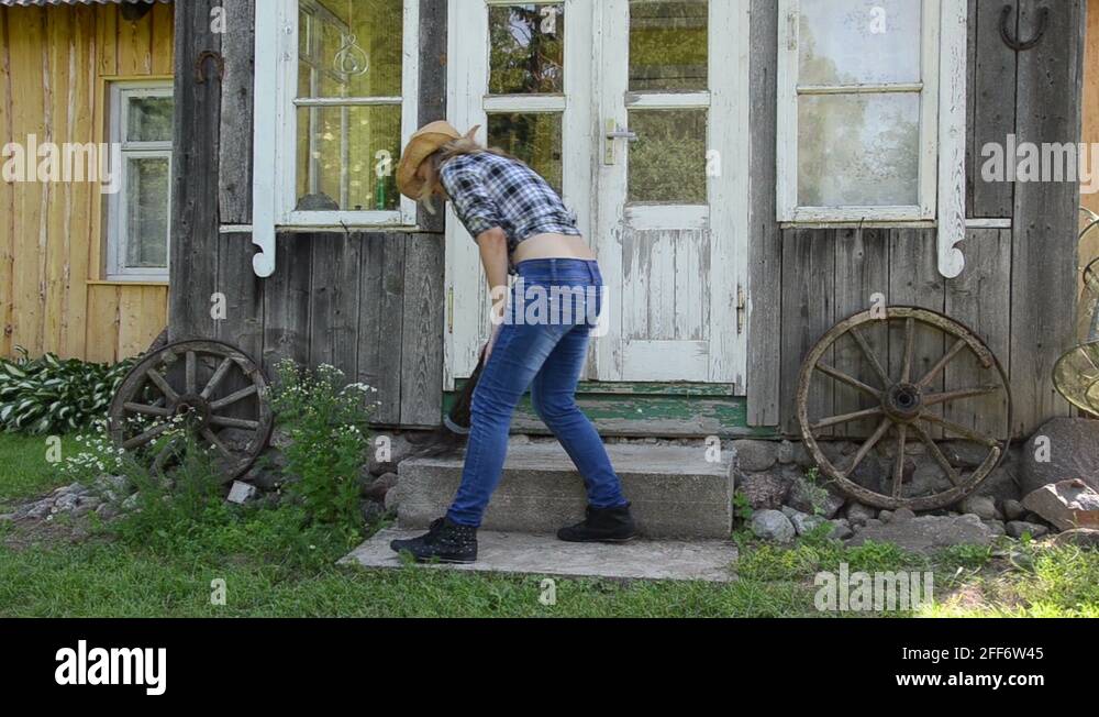 Worker woman clean sweep stairs with wooden broom in rural yard Stock ...