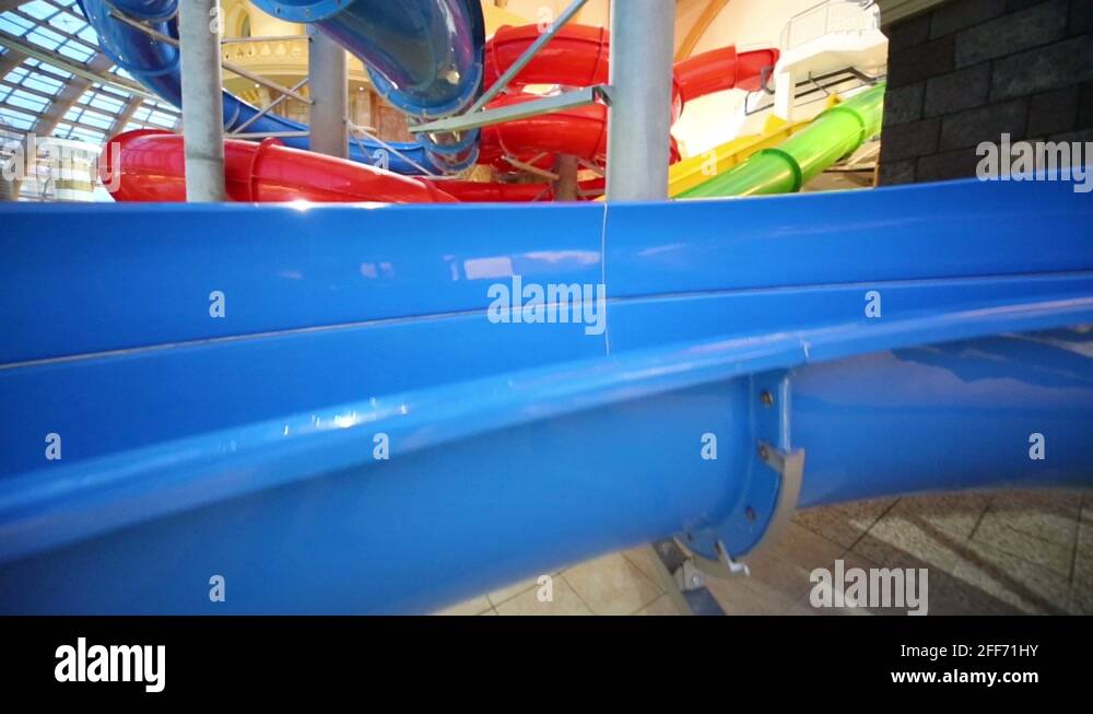 Interweaving of colorful water slides at the indoor water park Stock ...