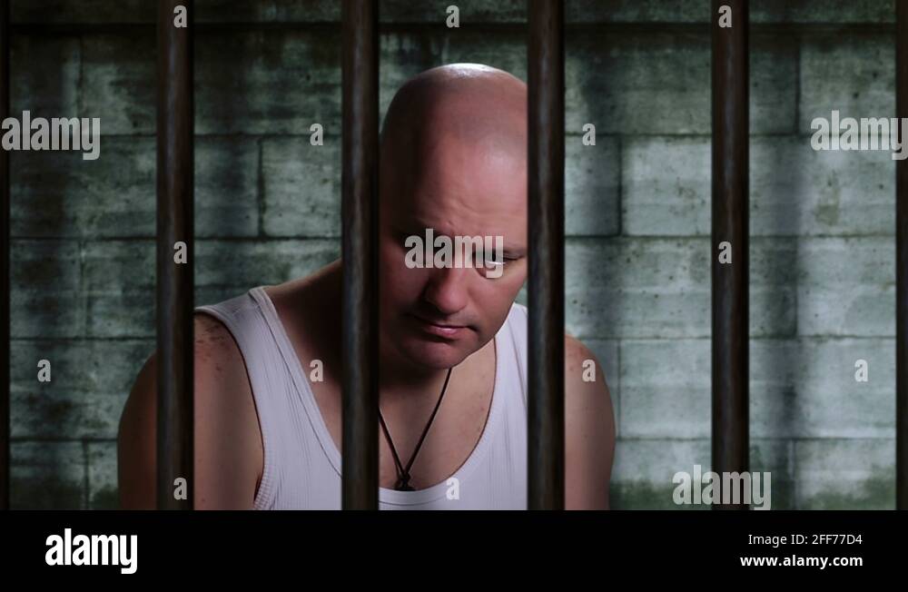 Prisoner in an old jail cell dramatic zoom in 2 Stock Video Footage - Alamy