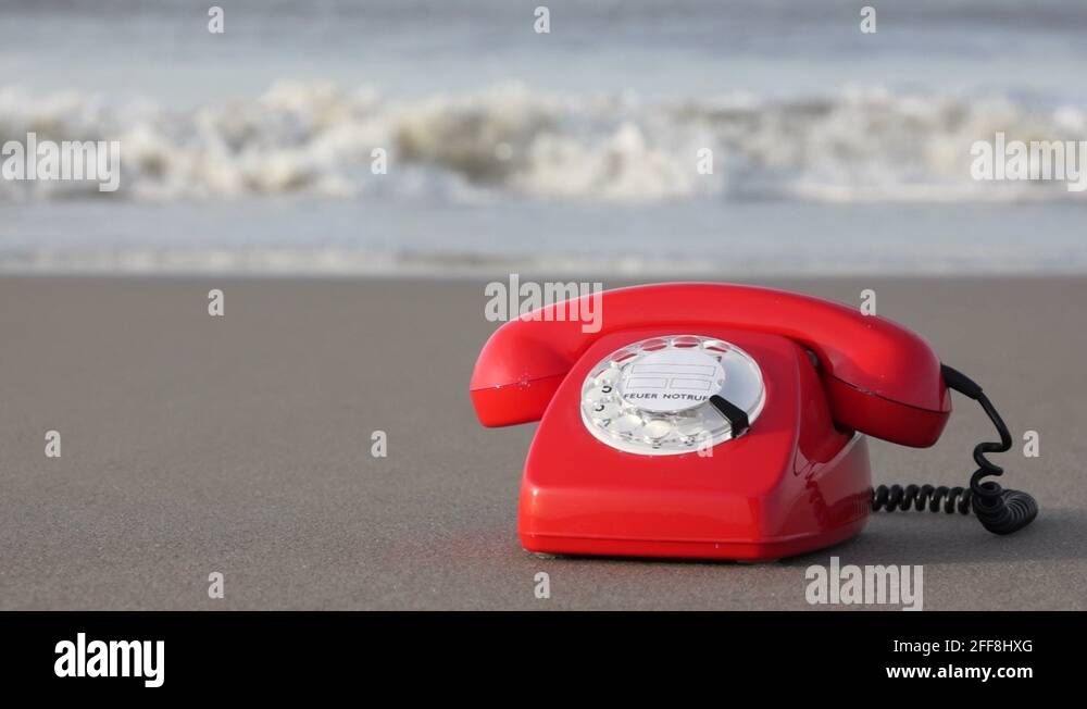 retro telephone on the beach Stock Video Footage - Alamy