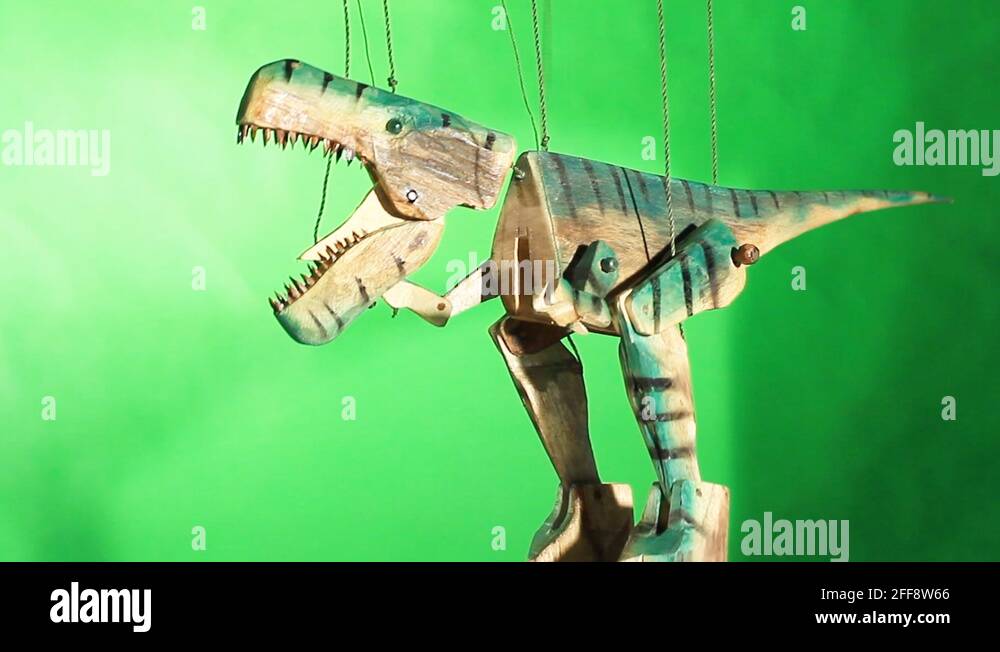 dinosaur puppet in the green screen Stock Video Footage - Alamy