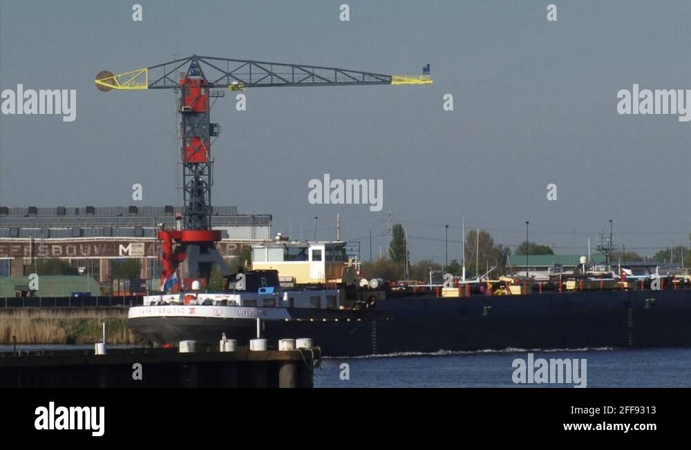 Rhine barge sailing, view at former NDSM shipyard, Crane Hotel ...