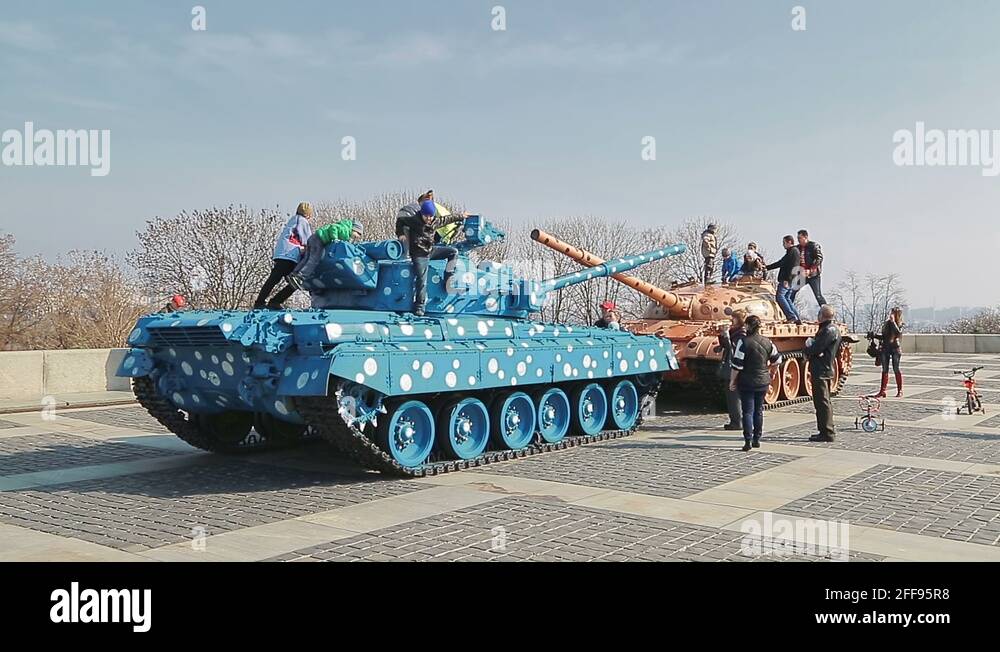 Kids playing on the colorful tanks Stock Video Footage - Alamy