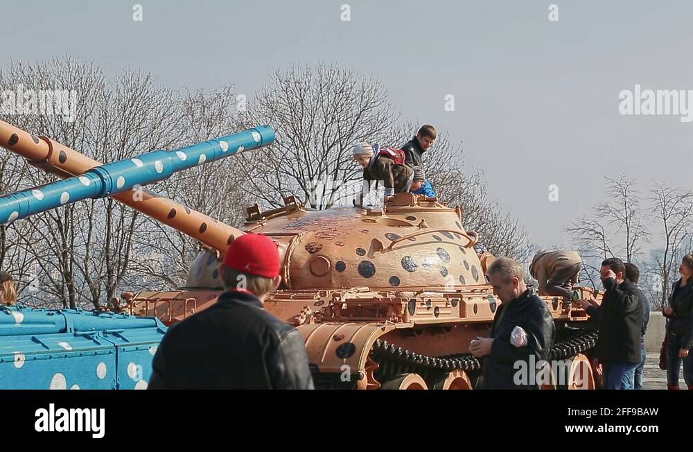 Kids playing on the colorful tanks in Museum of the Great Patriotic War ...