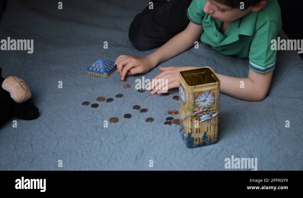 Boy counting coins Stock Videos & Footage - HD and 4K Video Clips - Alamy
