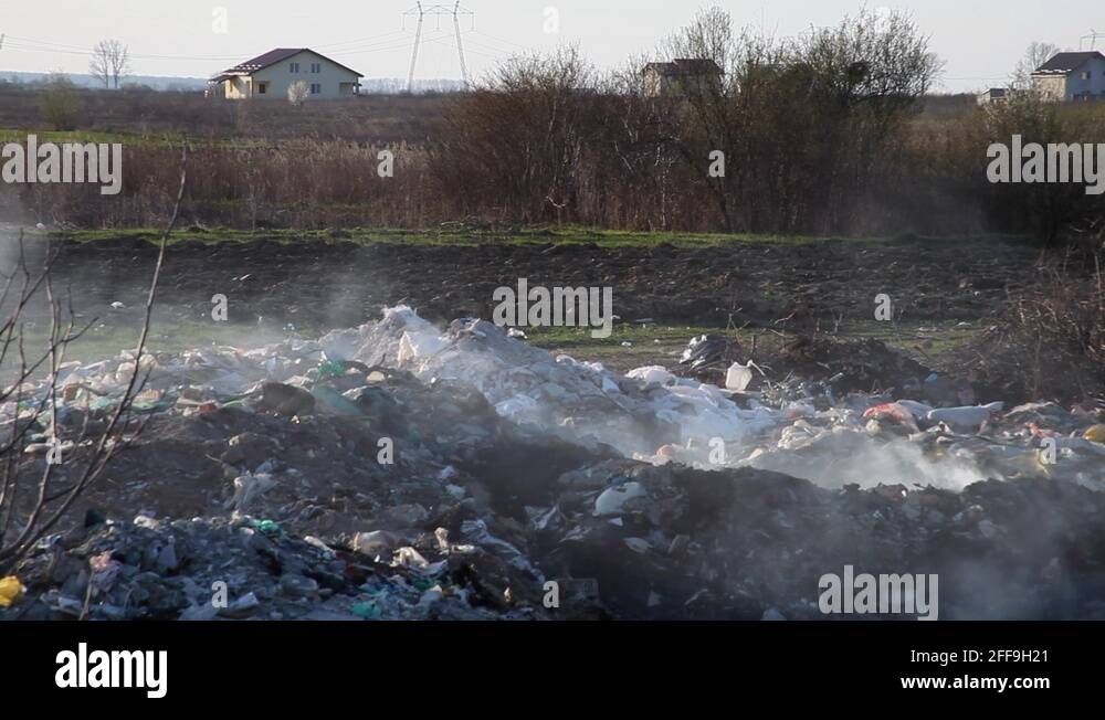 Burning trash, pollution, garbage dump, smoke, construction ...