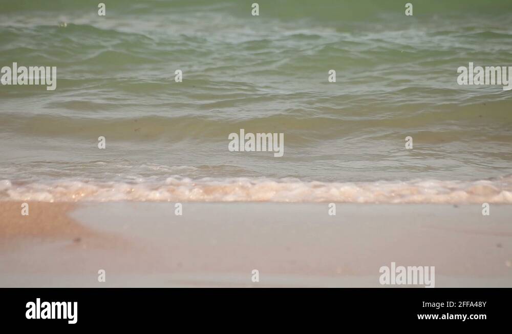 ocean waves washing beach sand backgrounds Stock Video Footage - Alamy