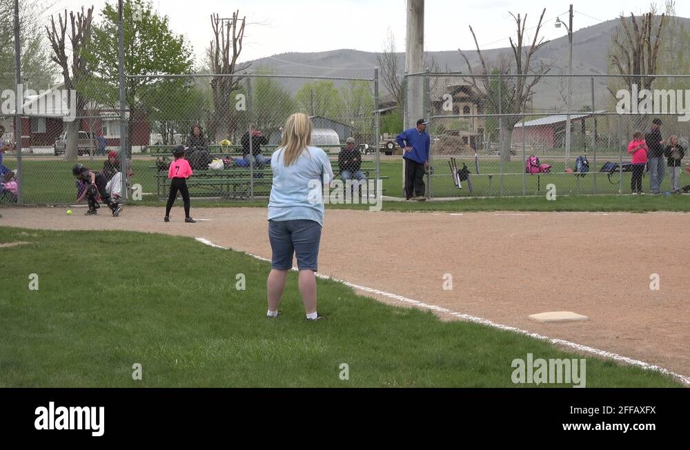 Softball game young girl hit ball run 4K 048 Stock Video Footage - Alamy