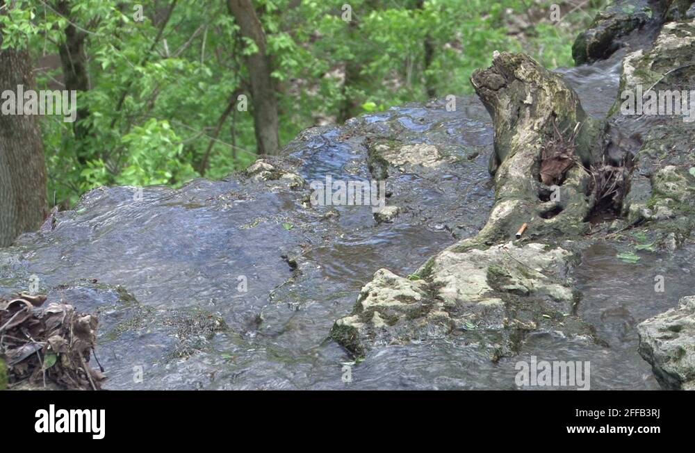 Water running flow side rocks fall cliff edge ledge danger stream creek ...