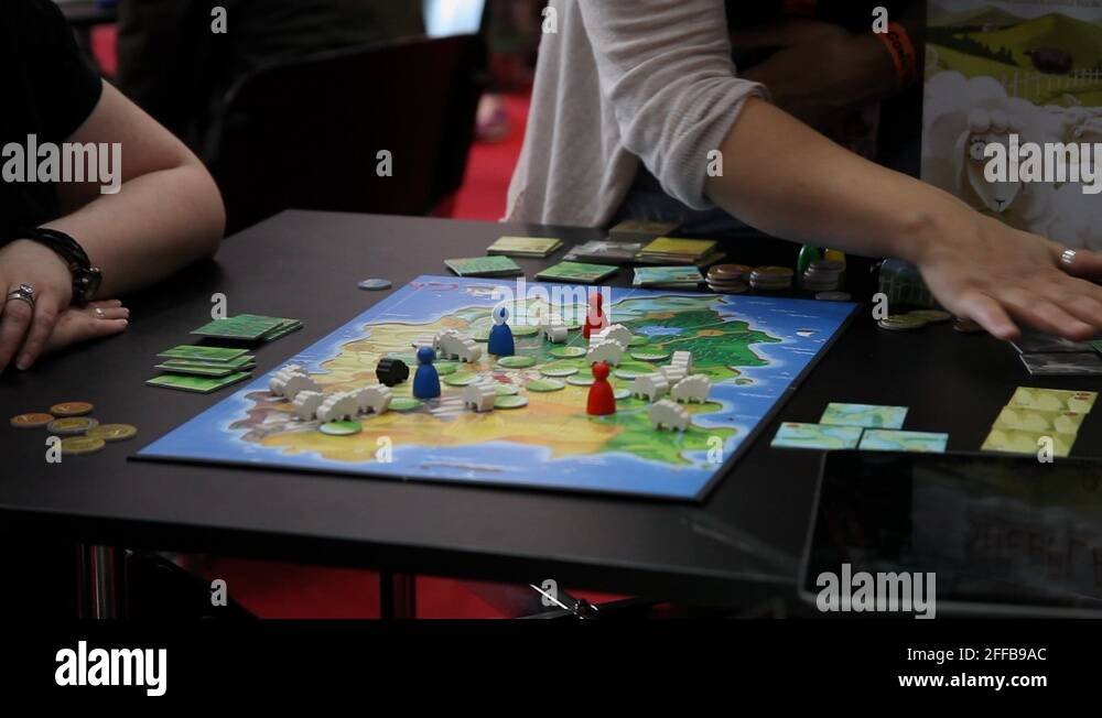 Board game, tabletop, girl explains game's rules, cards, figurines ...