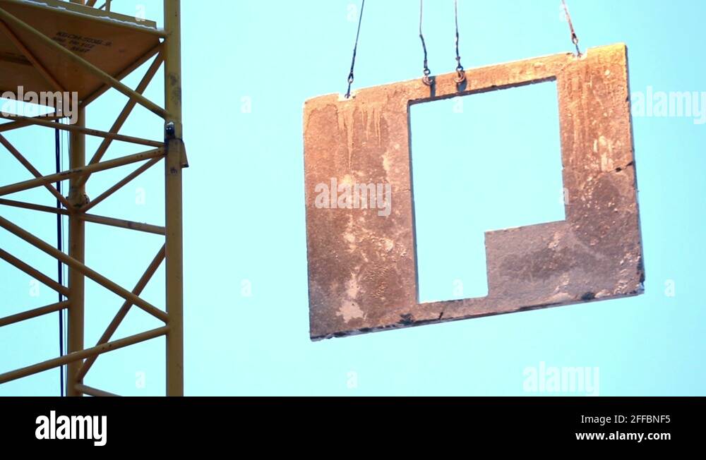 Crane lowers concrete slab to place it must be mounted Stock Video ...