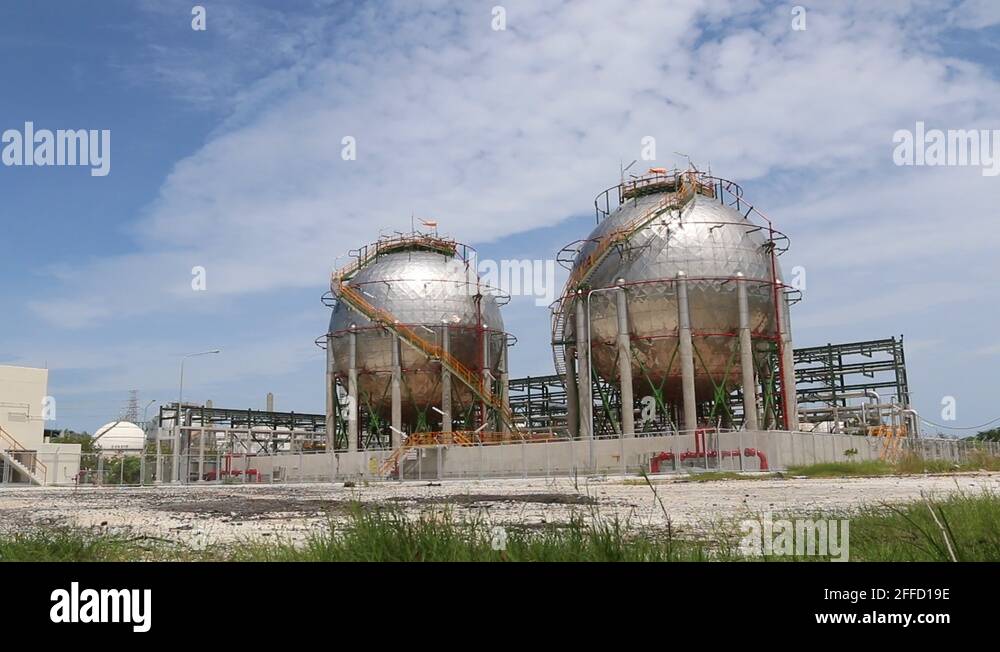 Spherical gas tank in the petroleum refinery Stock Video Footage - Alamy