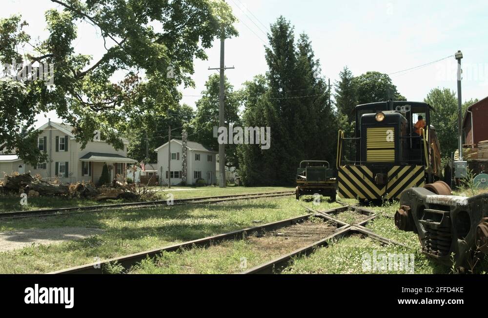 Diesel locomotive and train passing houses 4K Stock Video Footage - Alamy