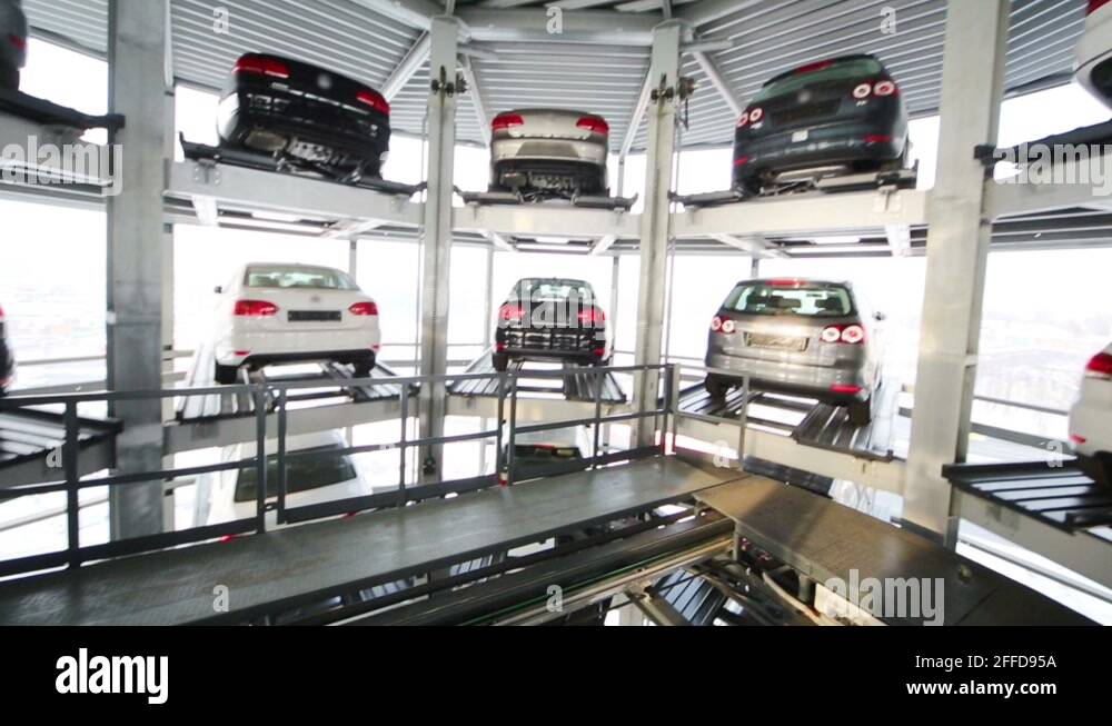 Rising empty elevator in modern glassy tower for car parking Stock ...