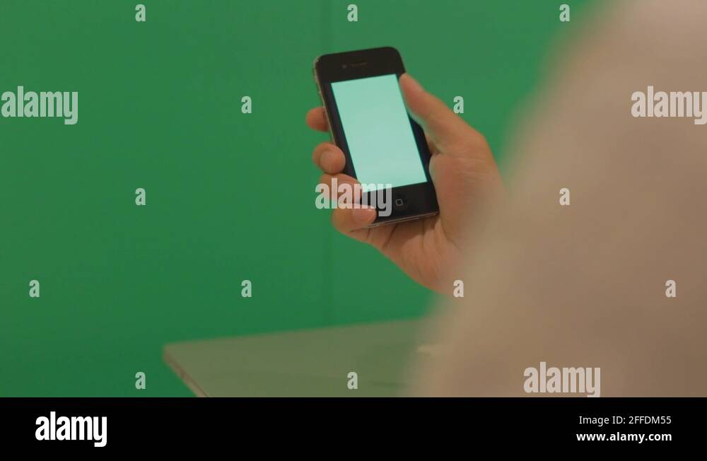 man check smartphone with green screen background and screen Stock ...