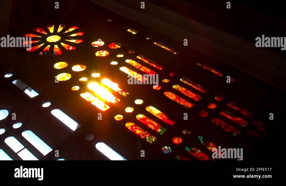 Sagrada Familia church. Sun light passes through the stained glass ...