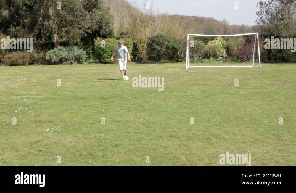 Boy playing football in garden Stock Videos & Footage - HD and 4K Video ...
