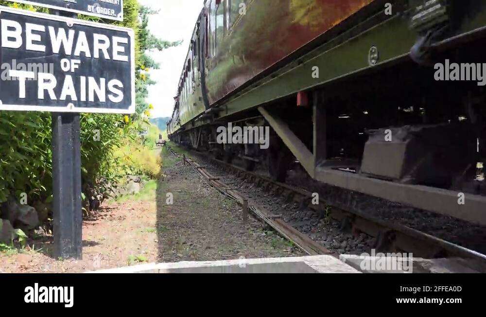 Steam Locomotive side view of carriage wheels and train warning sign ...