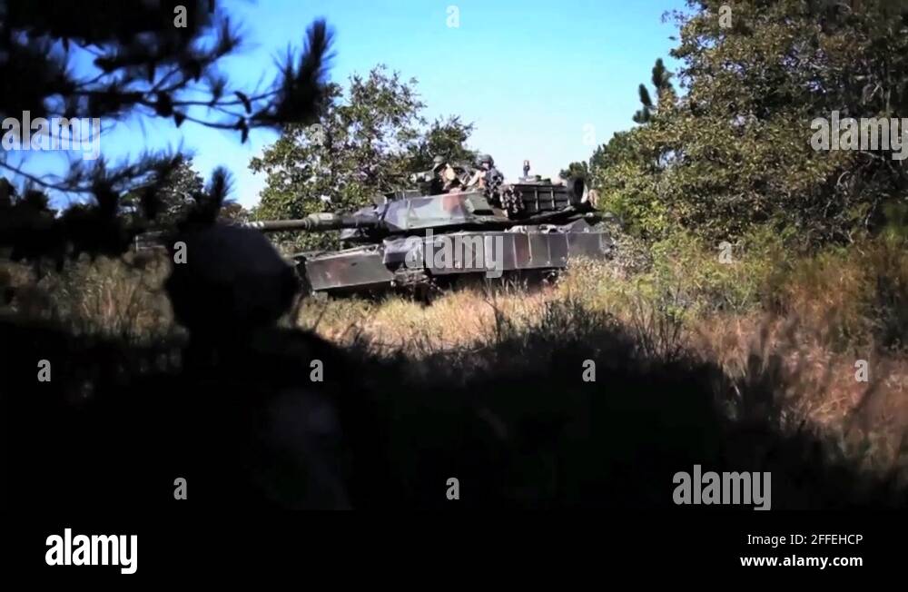 U.S. Marines conduct Tank Maneuvers - Tank drives over ridge in the ...