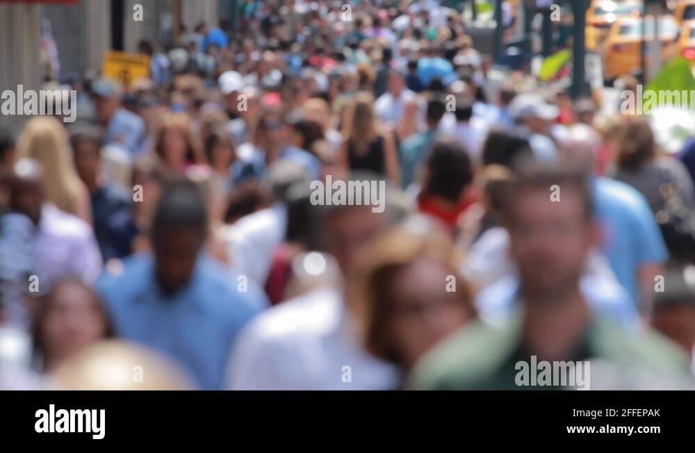 Crowd of people walking on city street sidewalk Stock Video Footage - Alamy
