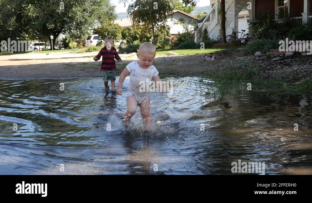 Children boy splash puddle Stock Videos & Footage - HD and 4K Video ...