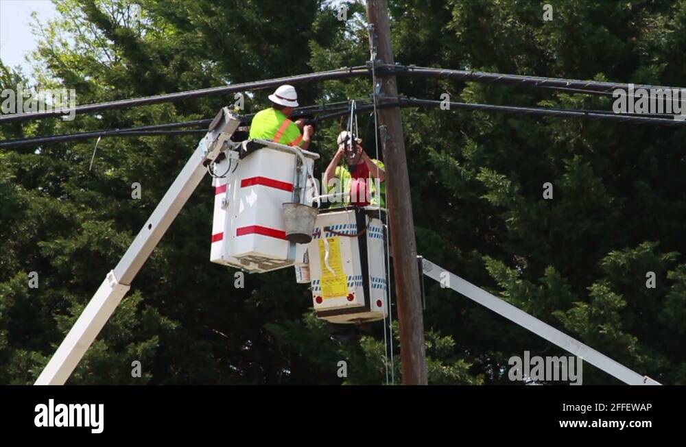 1966 Men Working on Power Lines in Slow Motion Stock Video Footage - Alamy