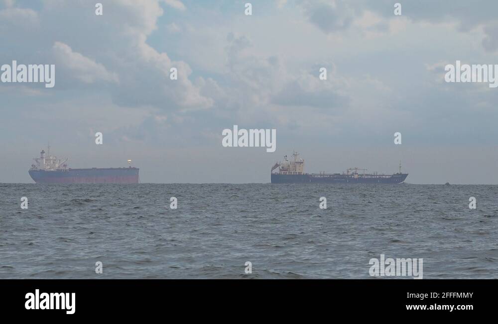 Two Cargo ship on horizon ocean sea 4k Stock Video Footage - Alamy