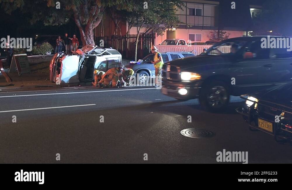 Emergency Scene Of Car On Its Side Stock Video Footage - Alamy
