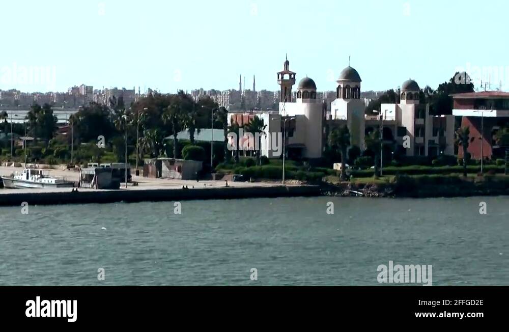 Egypt the Suez Canal 069 Port Said buildings and watchtower on a spit ...