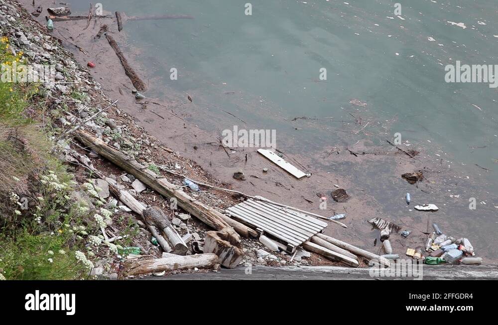 Water pollution floating plastic and aluminum cans, waste bottles and ...