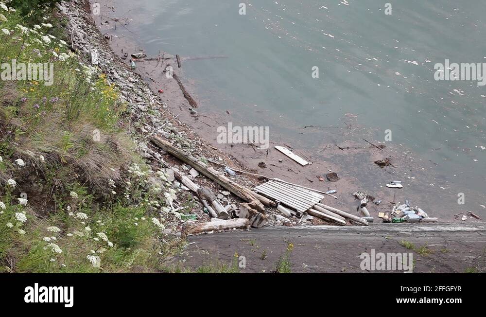 Garbage floating, lake shore, water pollution, plastic, trash ...