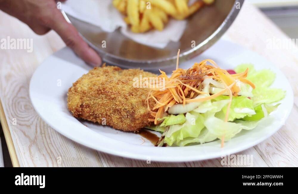 Fired chicken Stock Videos & Footage - HD and 4K Video Clips - Alamy