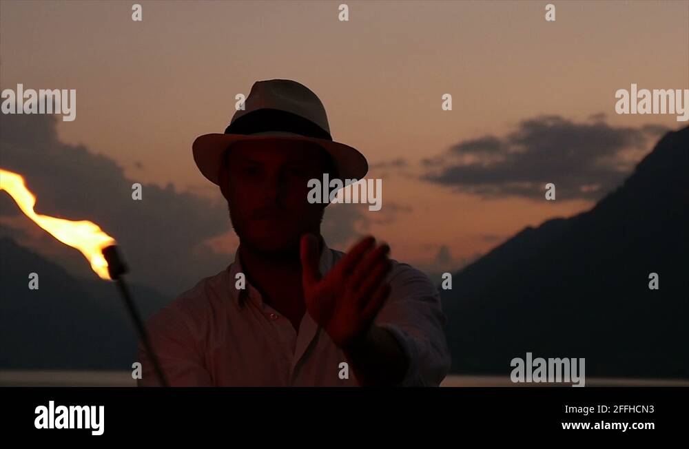 Man holding flame Stock Videos & Footage - HD and 4K Video Clips - Alamy